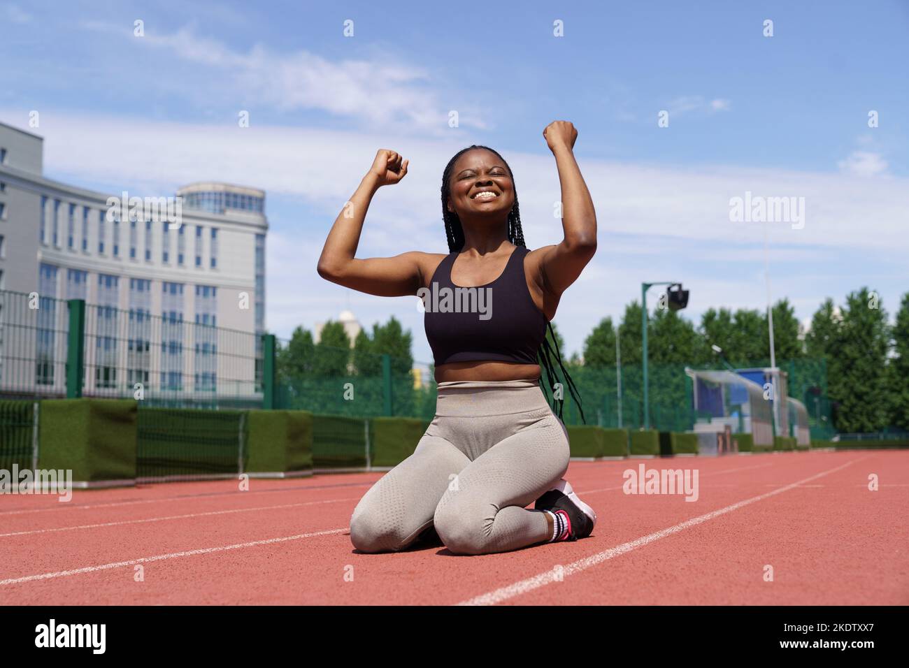 African American female athlete feels happy after running long distance ...