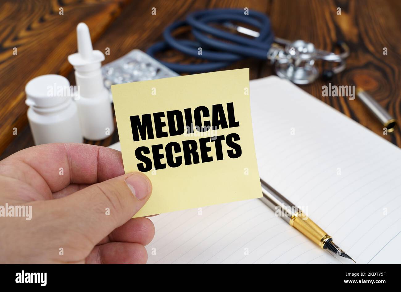 Medical concept. On the table is a notebook, medicines and a ...