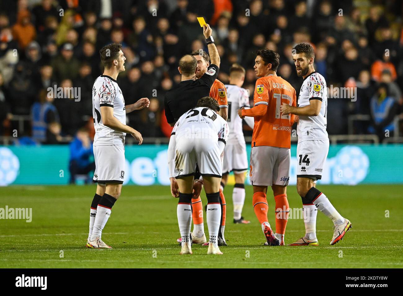 Referee Jeremy Simpson gives a yellow card to James Husband #3 of ...