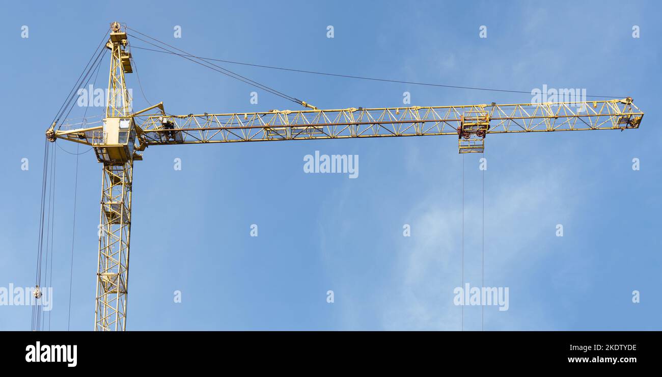 Crane tower at the construction site of a residential building. banner ...