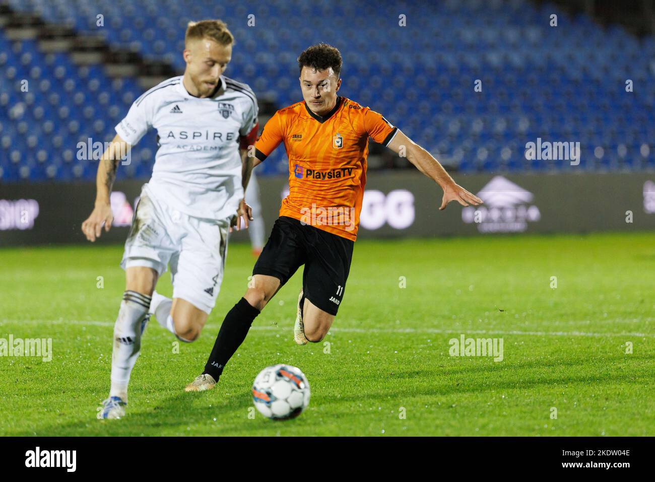 Eupen's James Jeggo and Deinze's Liridon Balaj fight for the ball ...