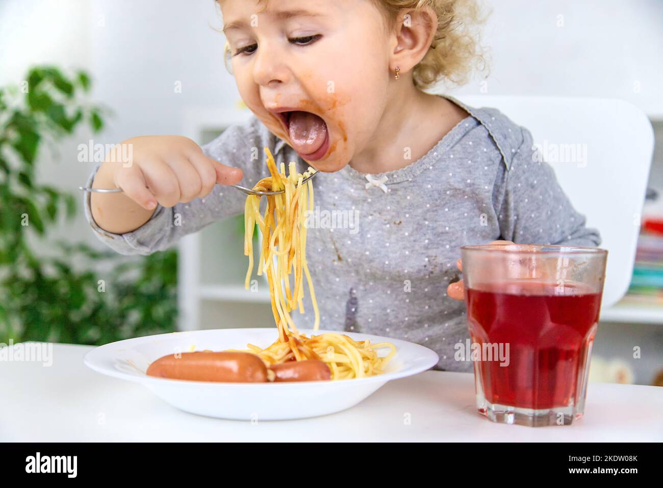 The child eats spaghetti lunch. Selective focus. Food Stock Photo - Alamy