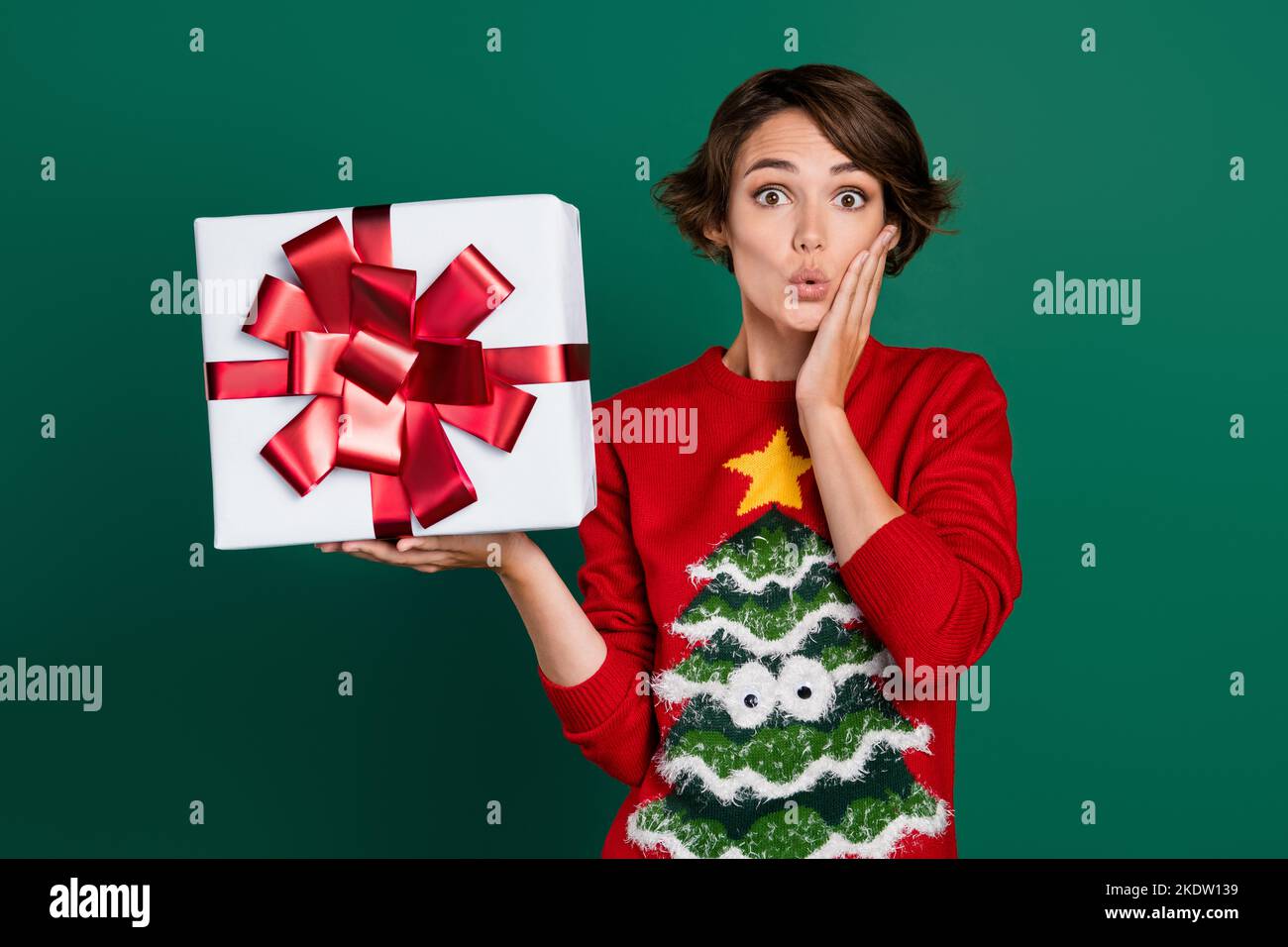 Photo of shocked funny girl dressed ugly print pullover arm cheekbone ...