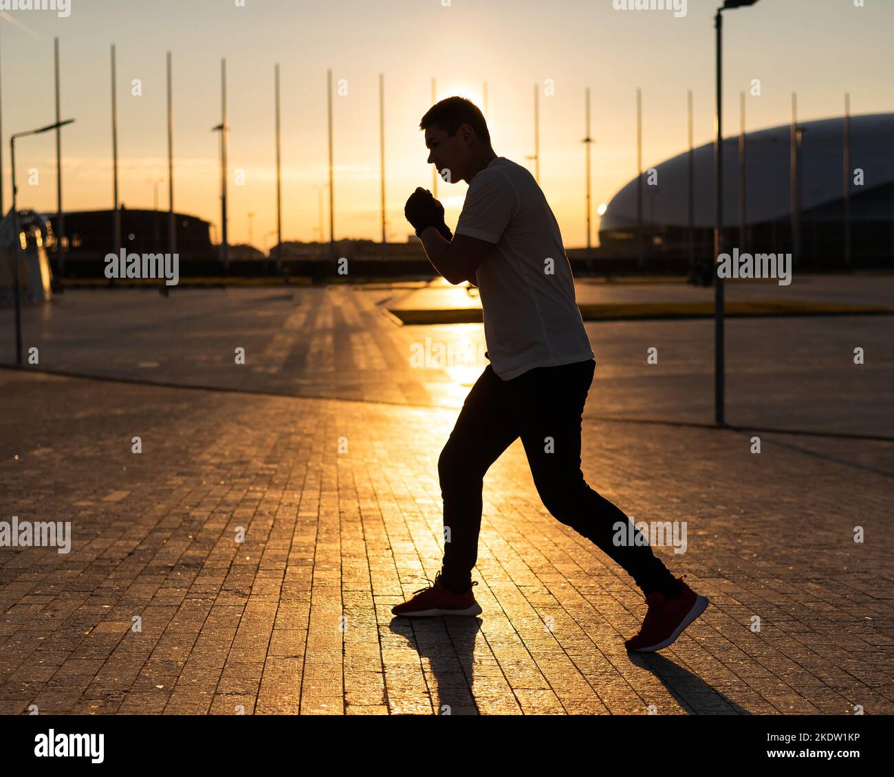 Muscular man silhouette boxing sunset hi-res stock photography and ...
