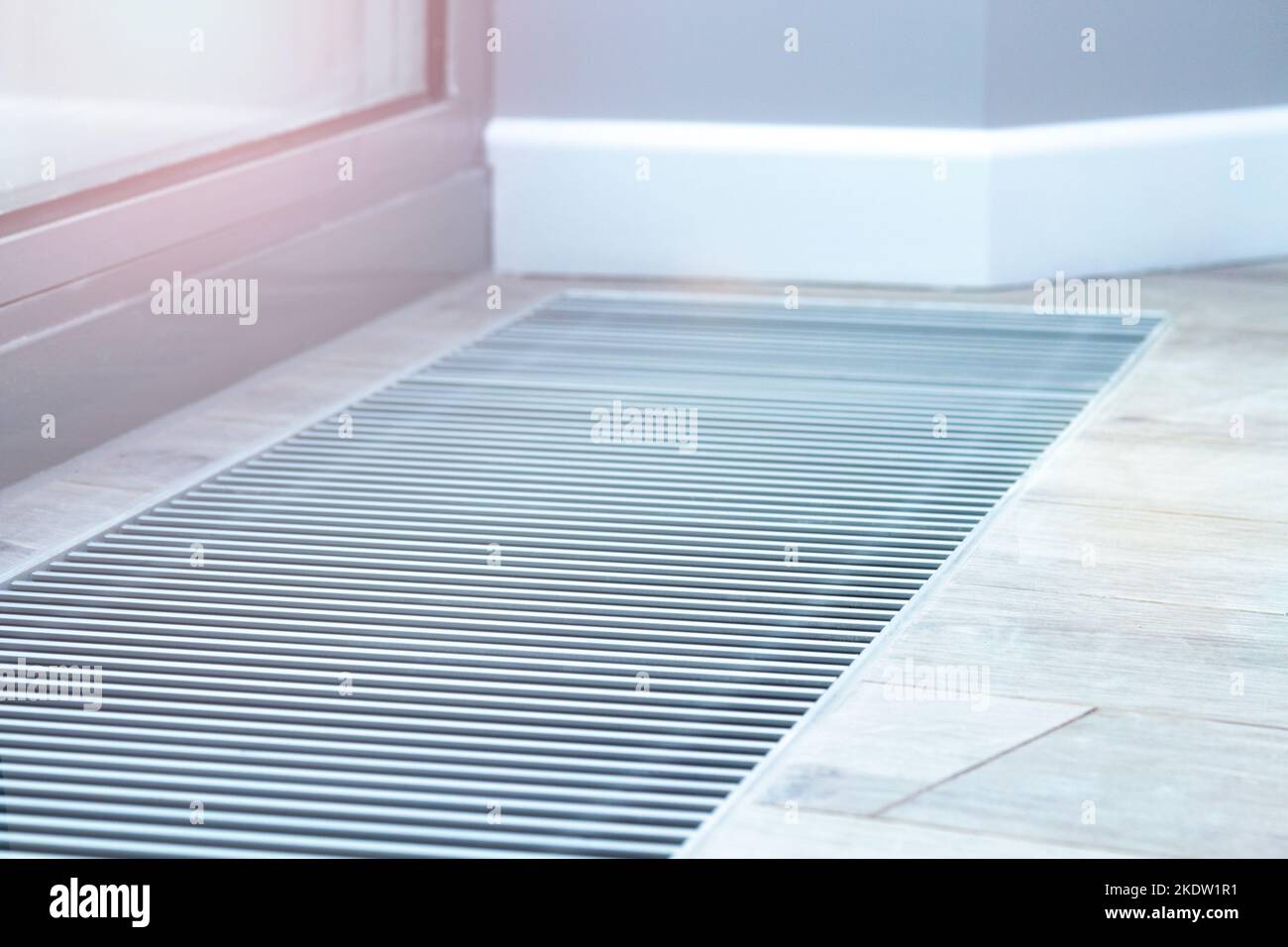 the convector heats the room, next to the window. The concept of ...