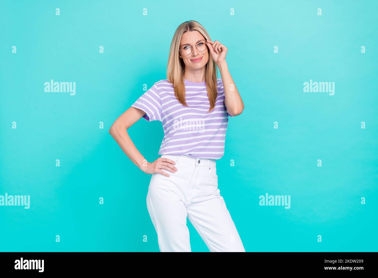 Photo of pretty adorable girl dressed purple striped t-shirt arm ...