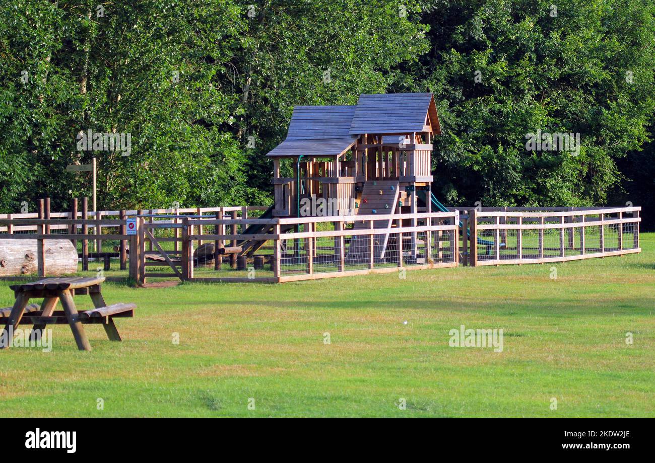 Childrens safe play area. Toys and child's play equipment behind a ...