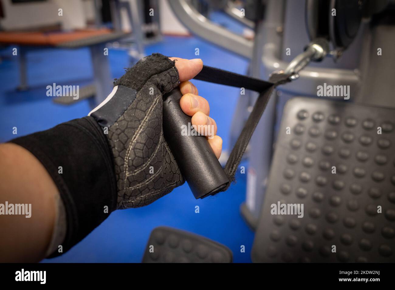 one hand pulls a pulley at the gym Stock Photo - Alamy