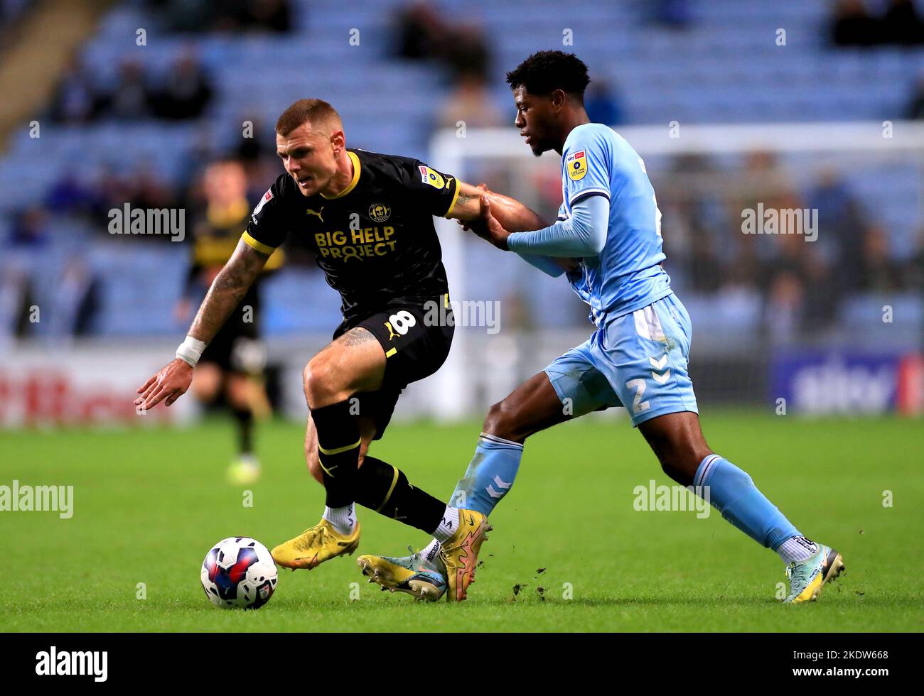Wigan Athletic's Max Power (left) and Coventry City's Jonathan Panzo ...