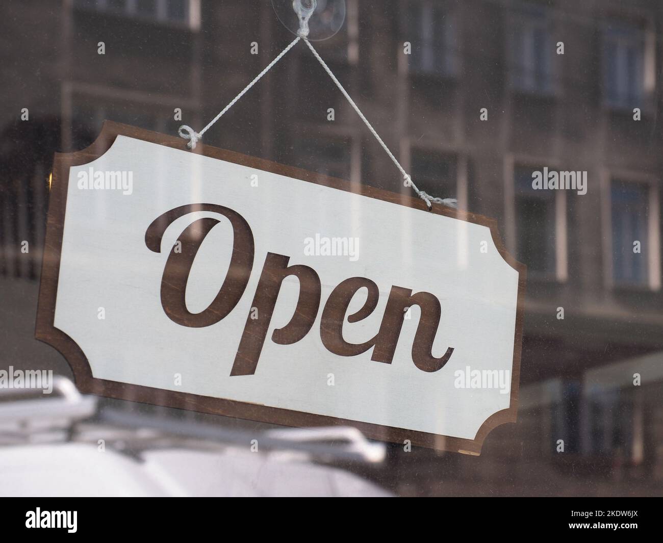 open sign in a shop window with reflections Stock Photo - Alamy
