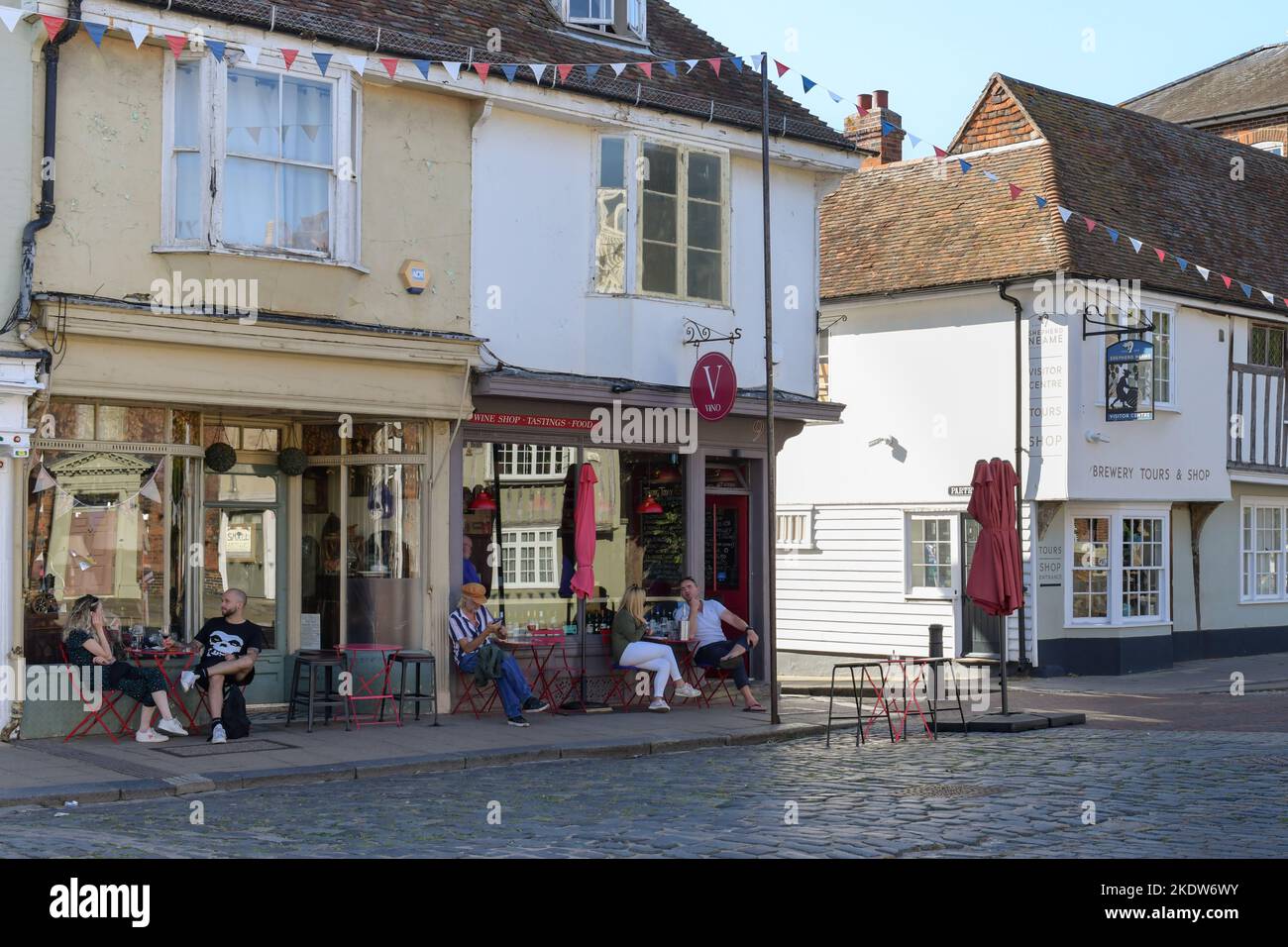 people sitting outside Vino wine shop on Court Street, Faversham in ...