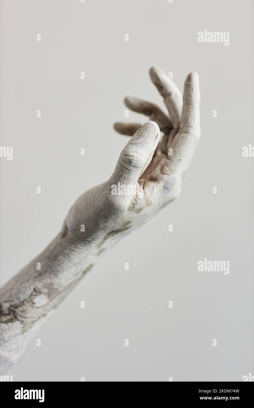 Minimal close up of male hand covered in white paint, human art form ...
