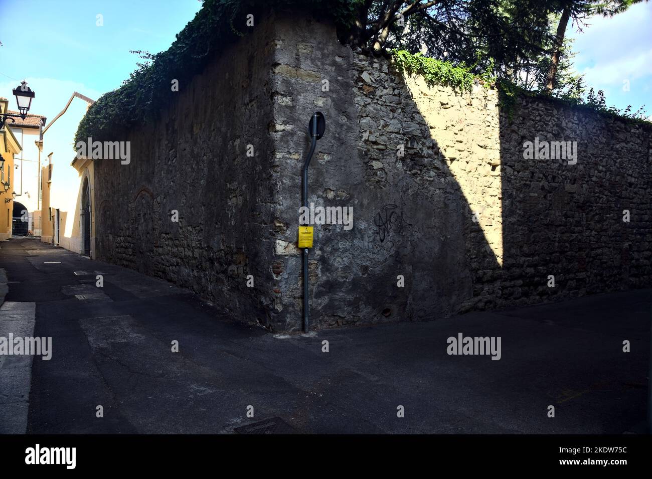 Corner of a narrow street in an italian town Stock Photo - Alamy