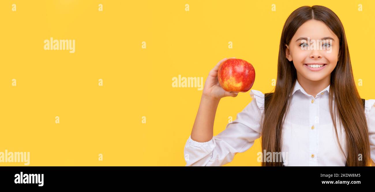 happy school kid in uniform hold apple. Child girl portrait with apple ...