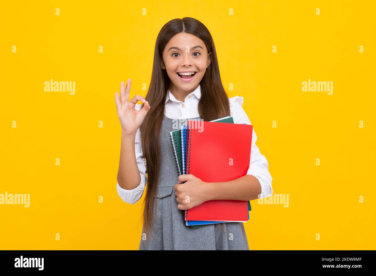 School child with book. Learning and education. Happy schoolgirl face ...