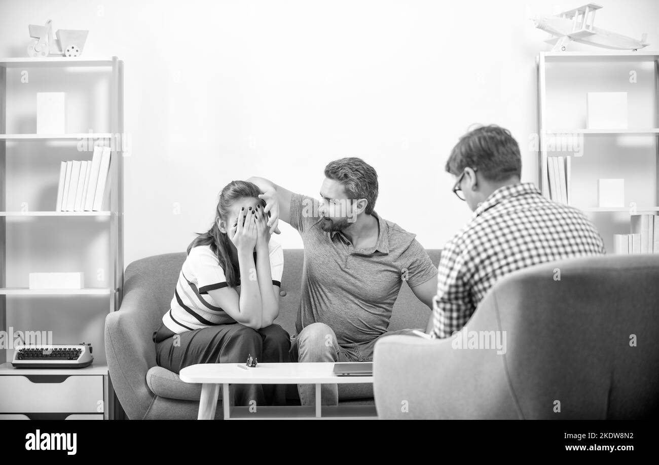 couple at psychologist session. family problems. man and woman talk to ...