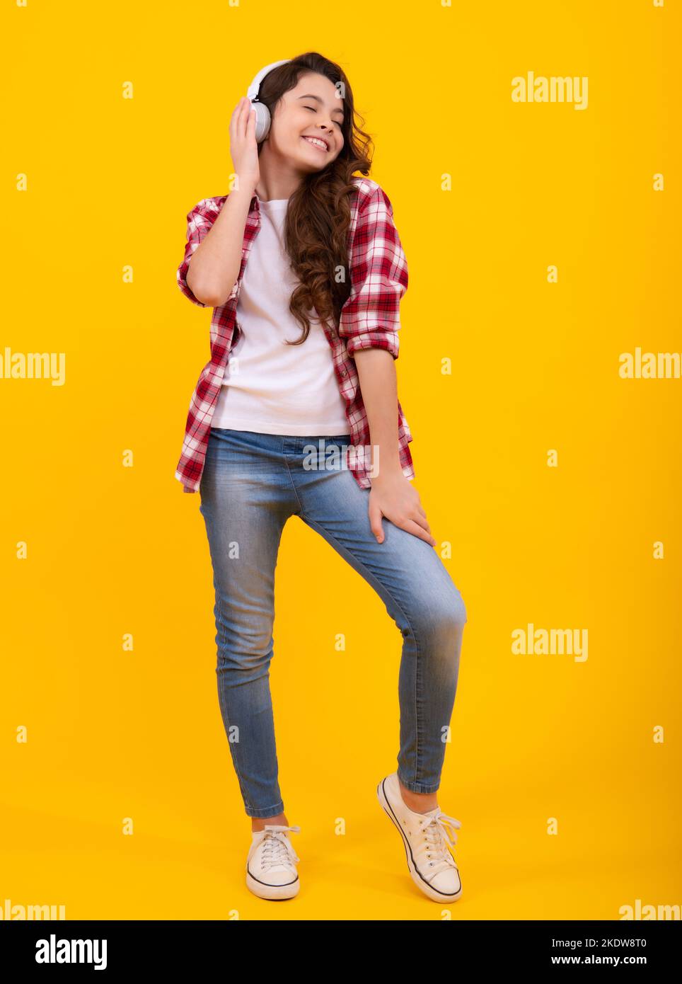 Funny kid girl 12, 13, 14 years old listen music with headphones ...