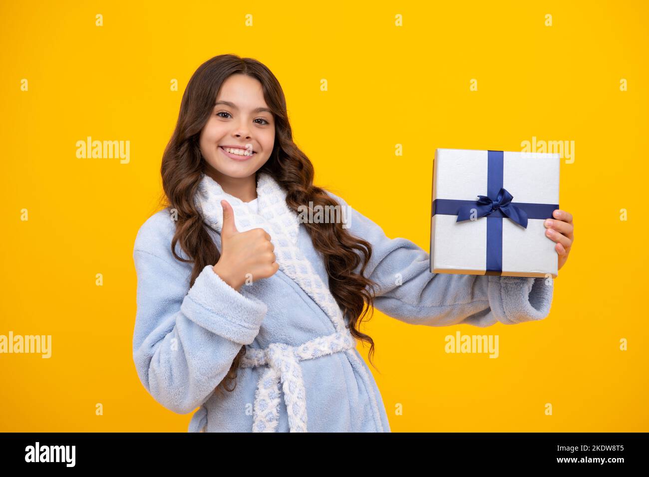 Teenager child with gift box, studio isolated background. Present for ...
