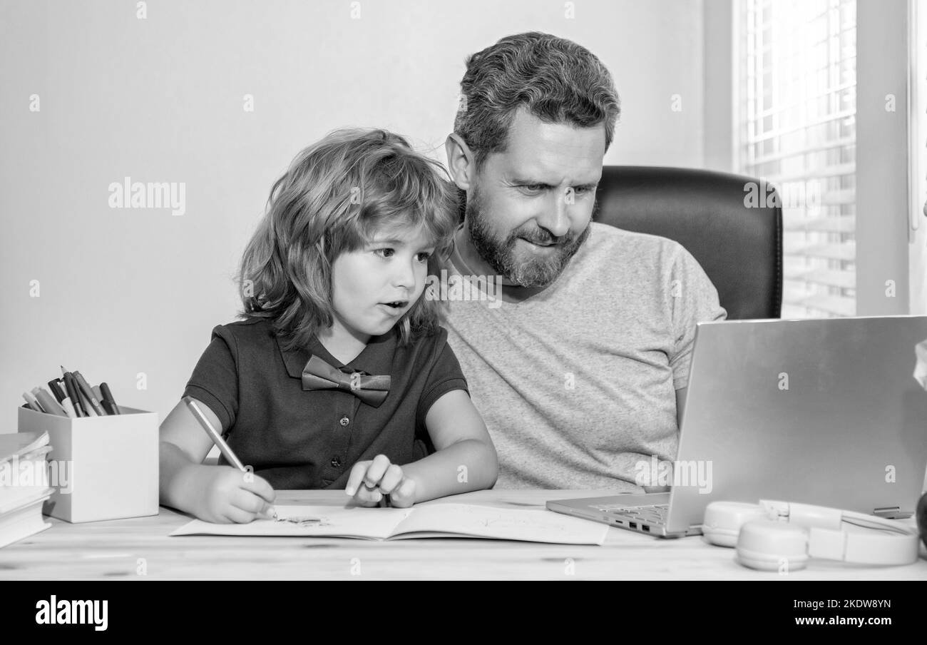 mature man teacher or dad helping kid son with school homework on ...
