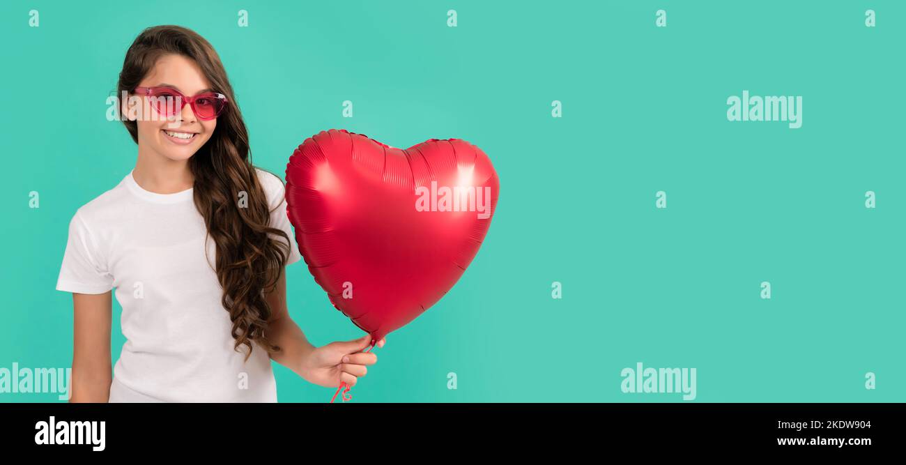 happy child in sunglasses hold red heart party balloon for valentines ...