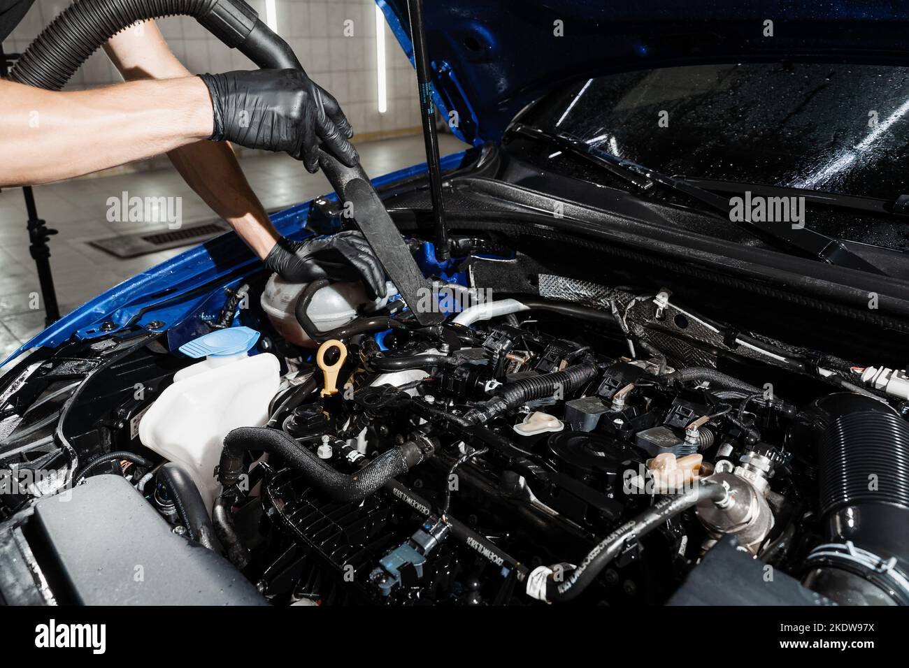 Process of drying car engine after washing with water and chemical ...