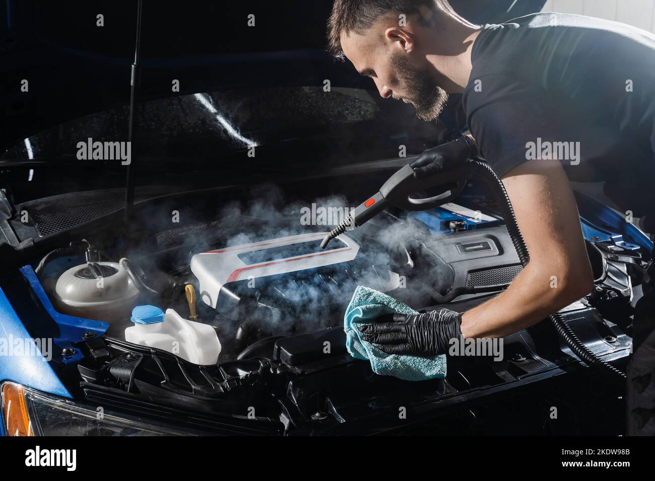 Process of drying car engine after washing with water and chemical ...