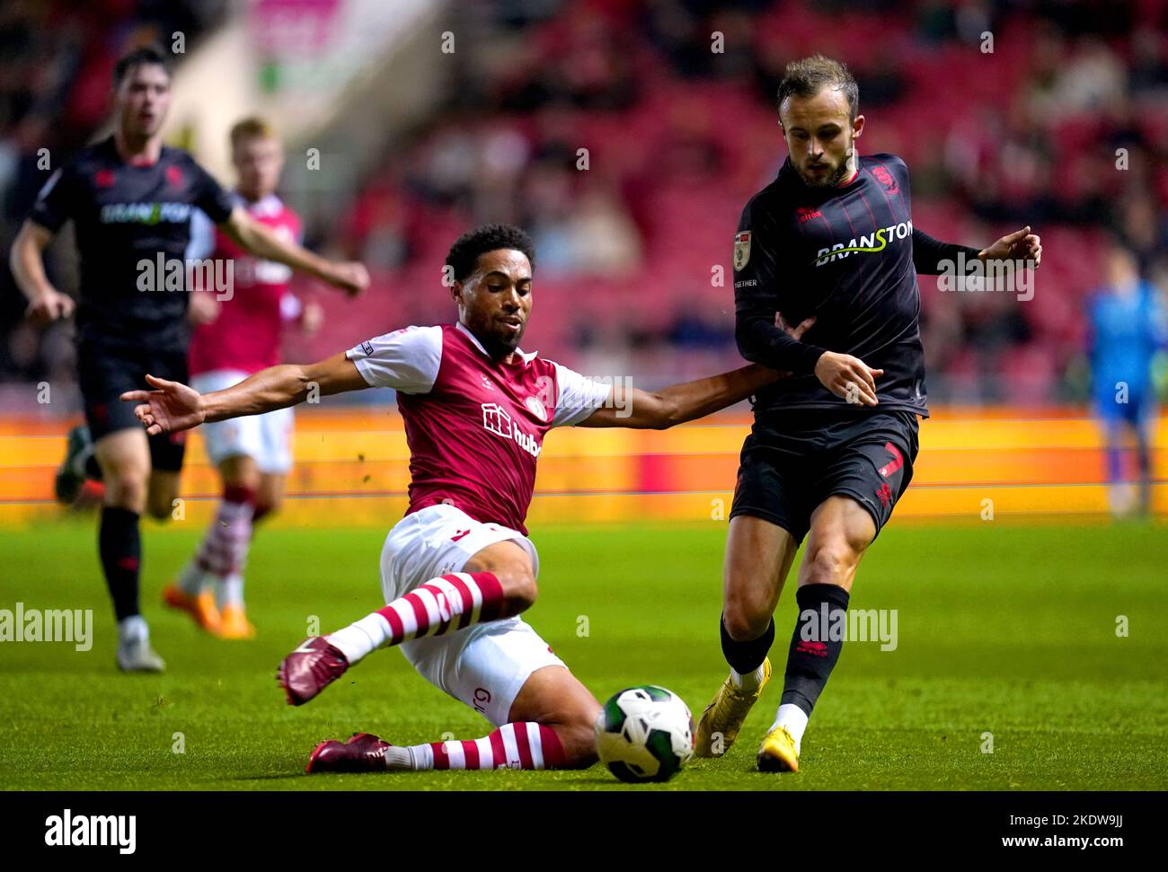 Bristol City's Zak Vyner (left) and Lincoln City's Charles Vernam ...