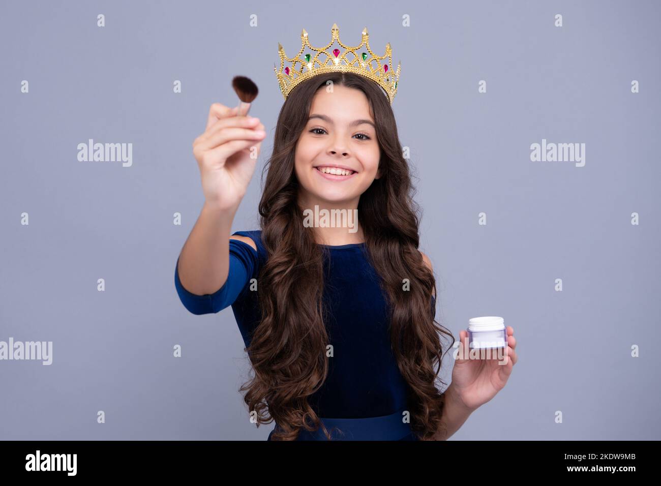 Beauty, make up and kids cosmetics. Teenage girl with brush applying ...