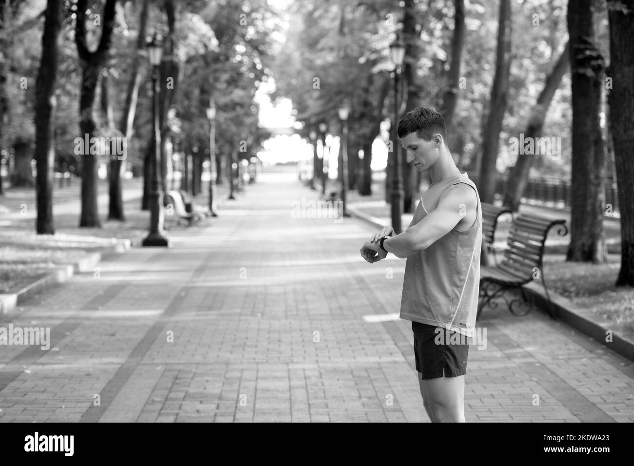 man checking time on smartwatch, copy space Stock Photo - Alamy
