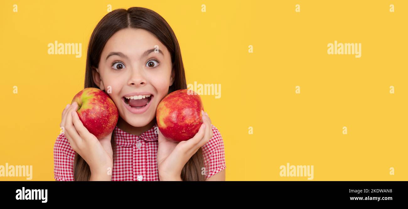 surprised kid hold healthy apple fruit with vitamin. Child girl ...