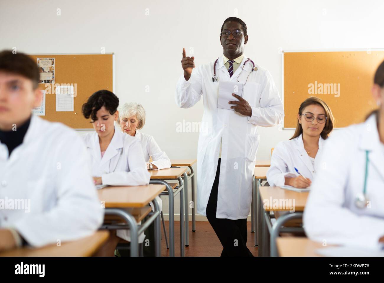 Professor talking to medical students in classroom Stock Photo - Alamy