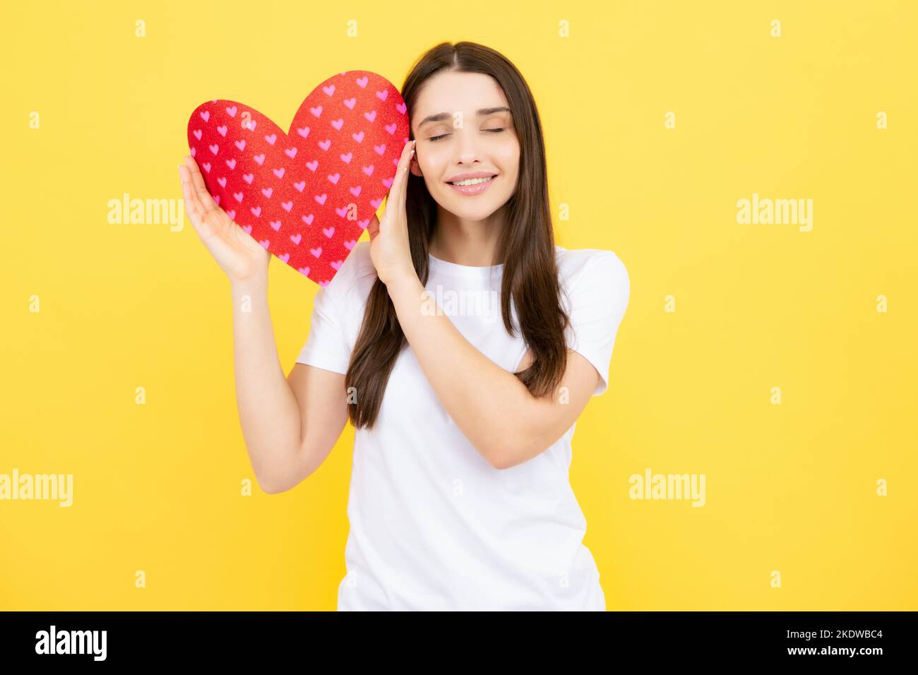 Young woman valentines day concept, girl with heart shaped card. Lovely ...