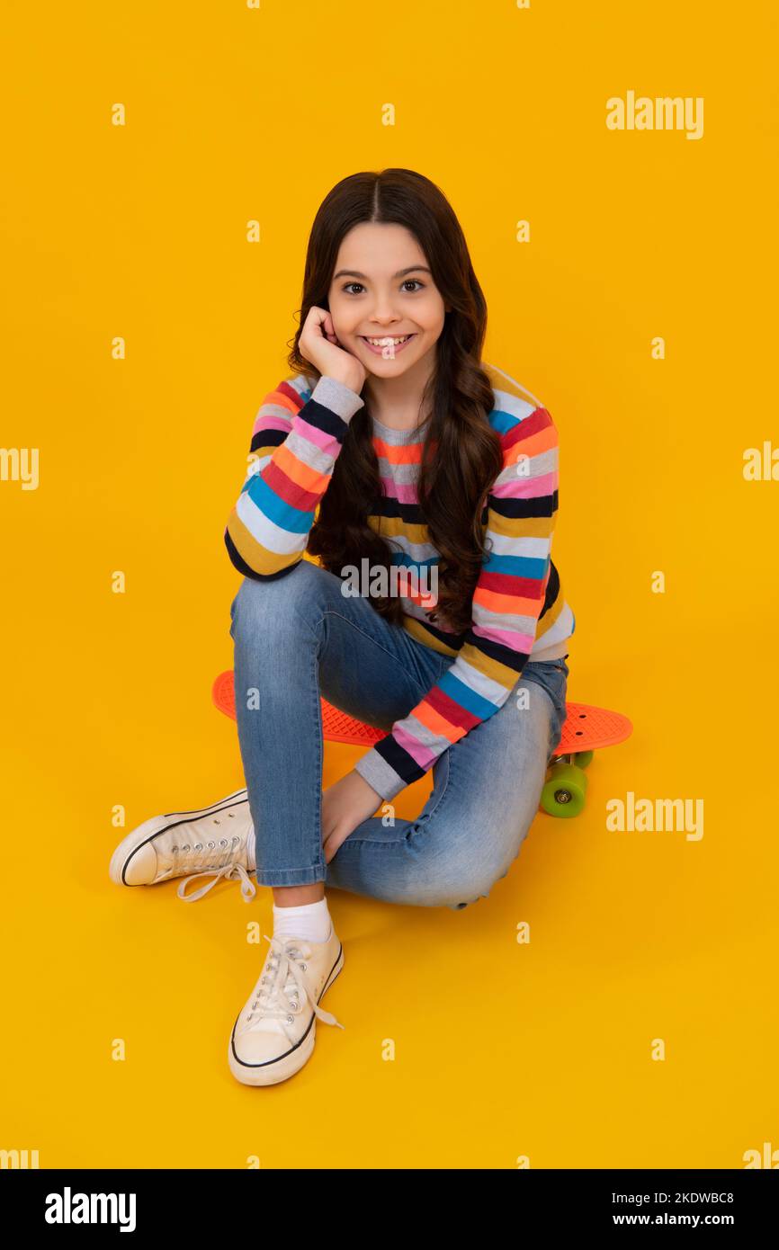 Teenagers youth casual culture. Teen girl with skateboard over isolated ...