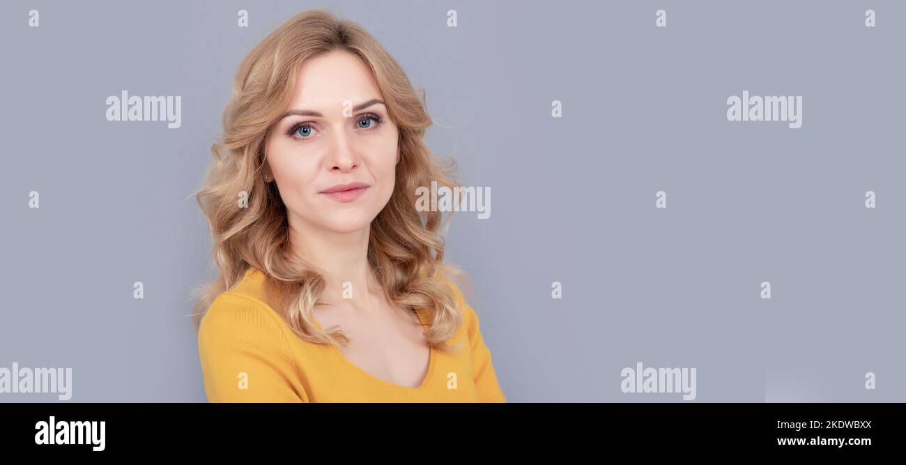 cheerful blonde beauty woman with curly hair, face skin. Woman isolated face portrait, banner ...