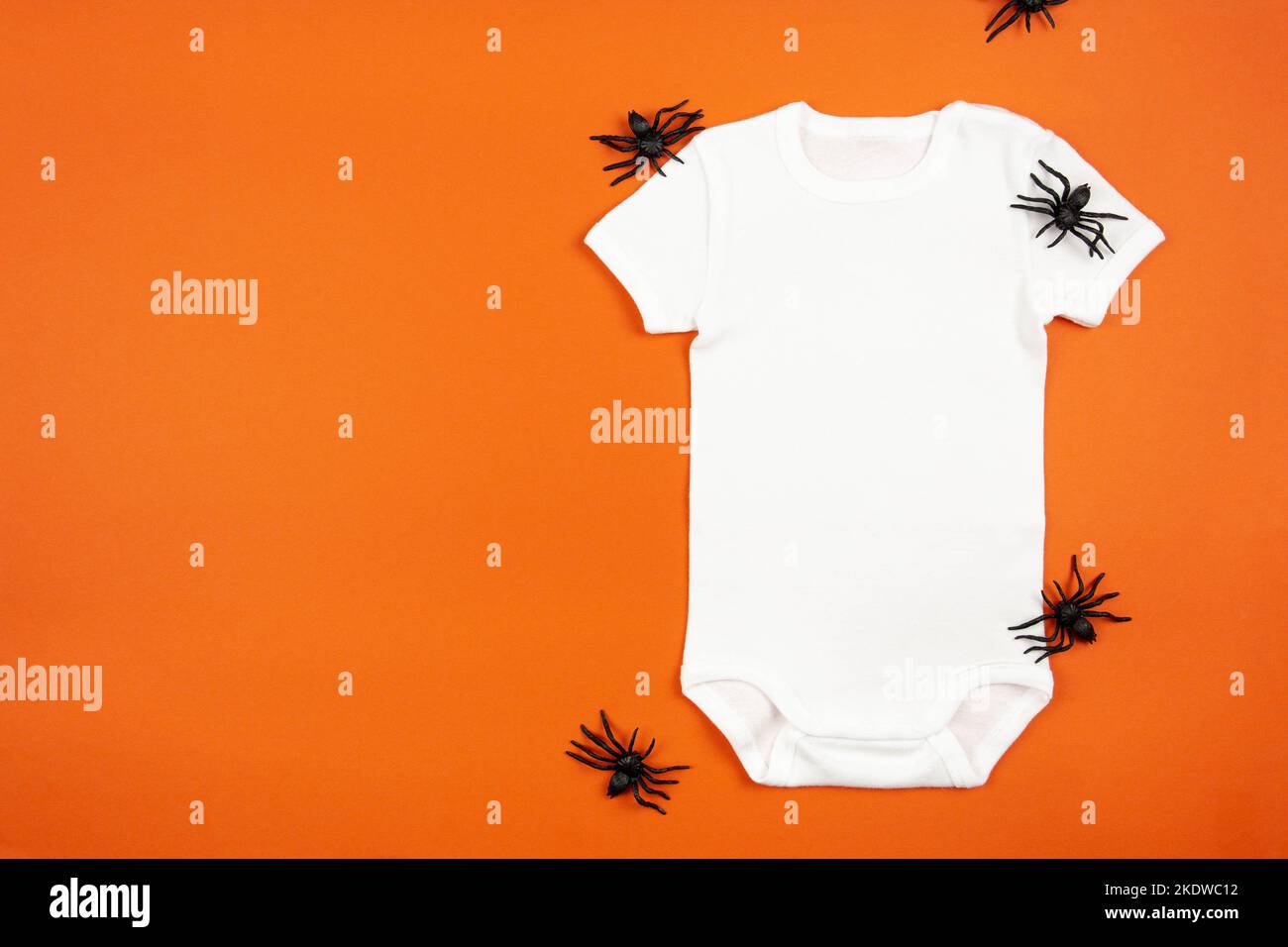 Halloween white baby girl or boy bodysuit mockup flat lay with spiders ...
