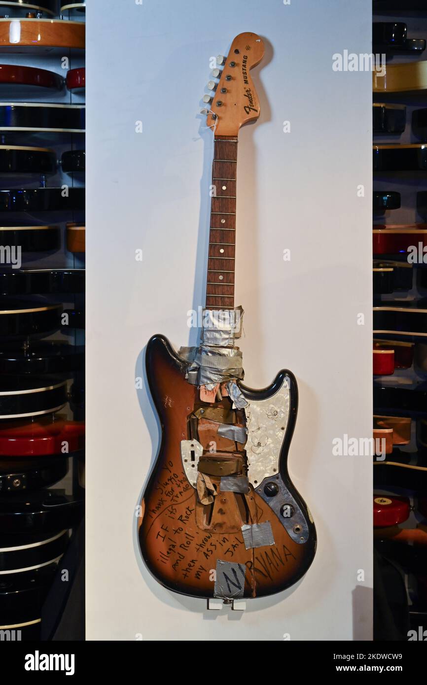 A 1973 Fender Mustang guitar owned, stage-played, smashed and signed by ... A 1973 Fender Mustang guitar owned, stage-played, smashed and signed by ...