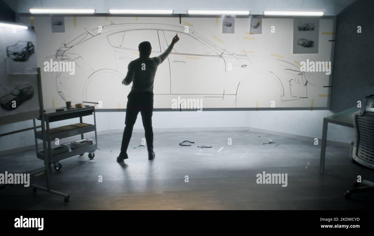 Back view of automotive african american male designer drawing sketch ...