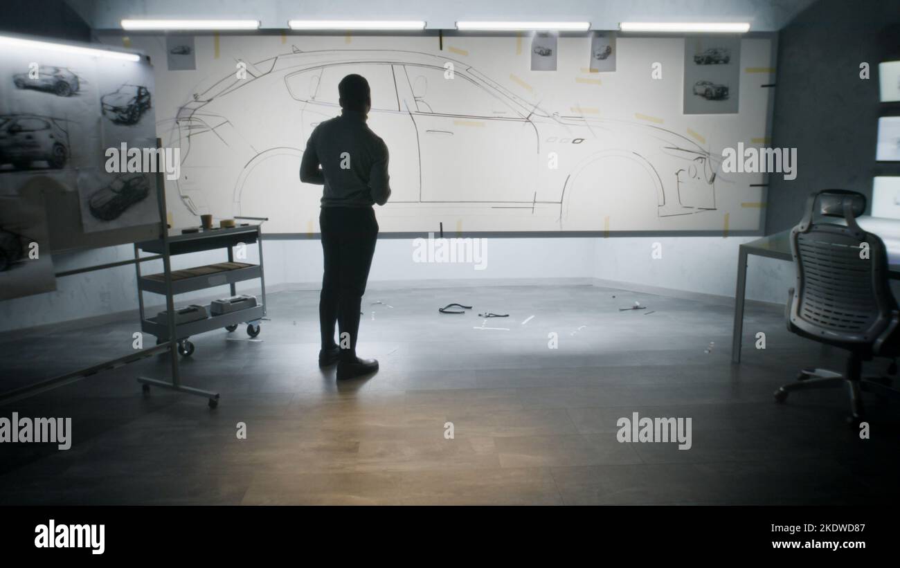 Back view of automotive african american male designer drawing sketch ...