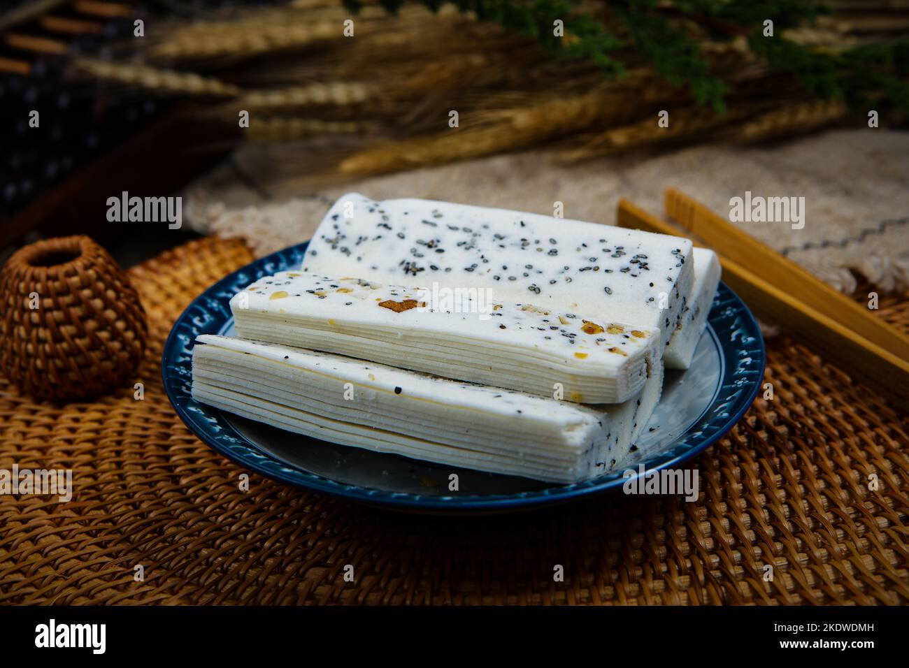 A small amount of delicious white square rice cake Stock Photo - Alamy