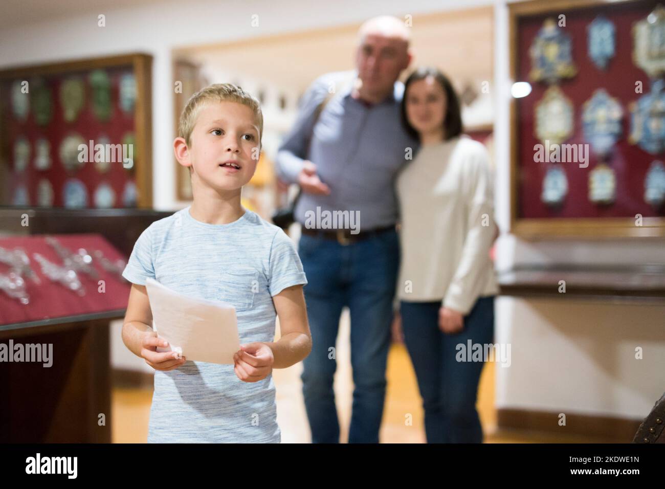Family visiting museum Stock Photo - Alamy