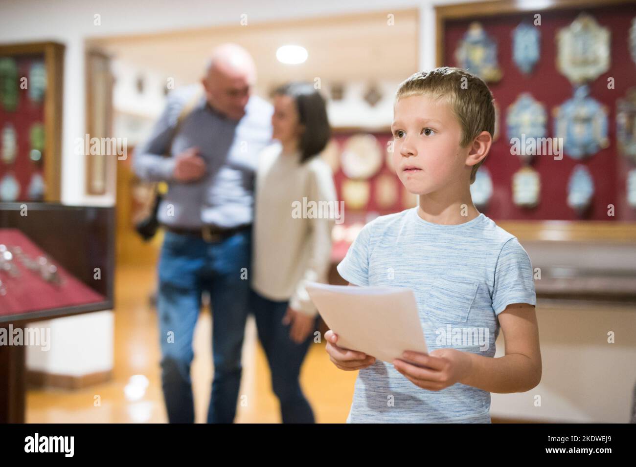 Family visiting museum Stock Photo - Alamy