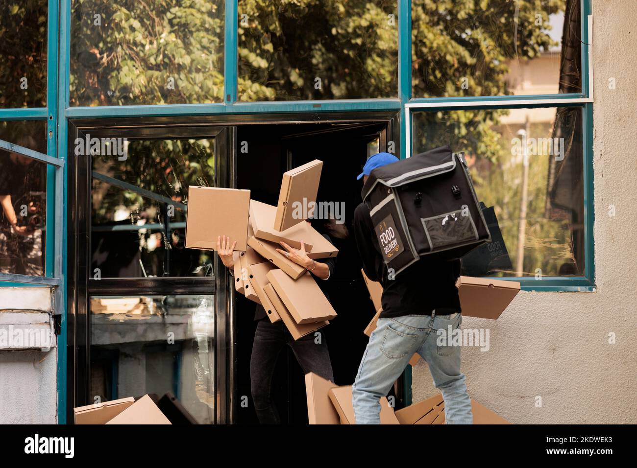 Delivery man falling stack boxes hi-res stock photography and images ...