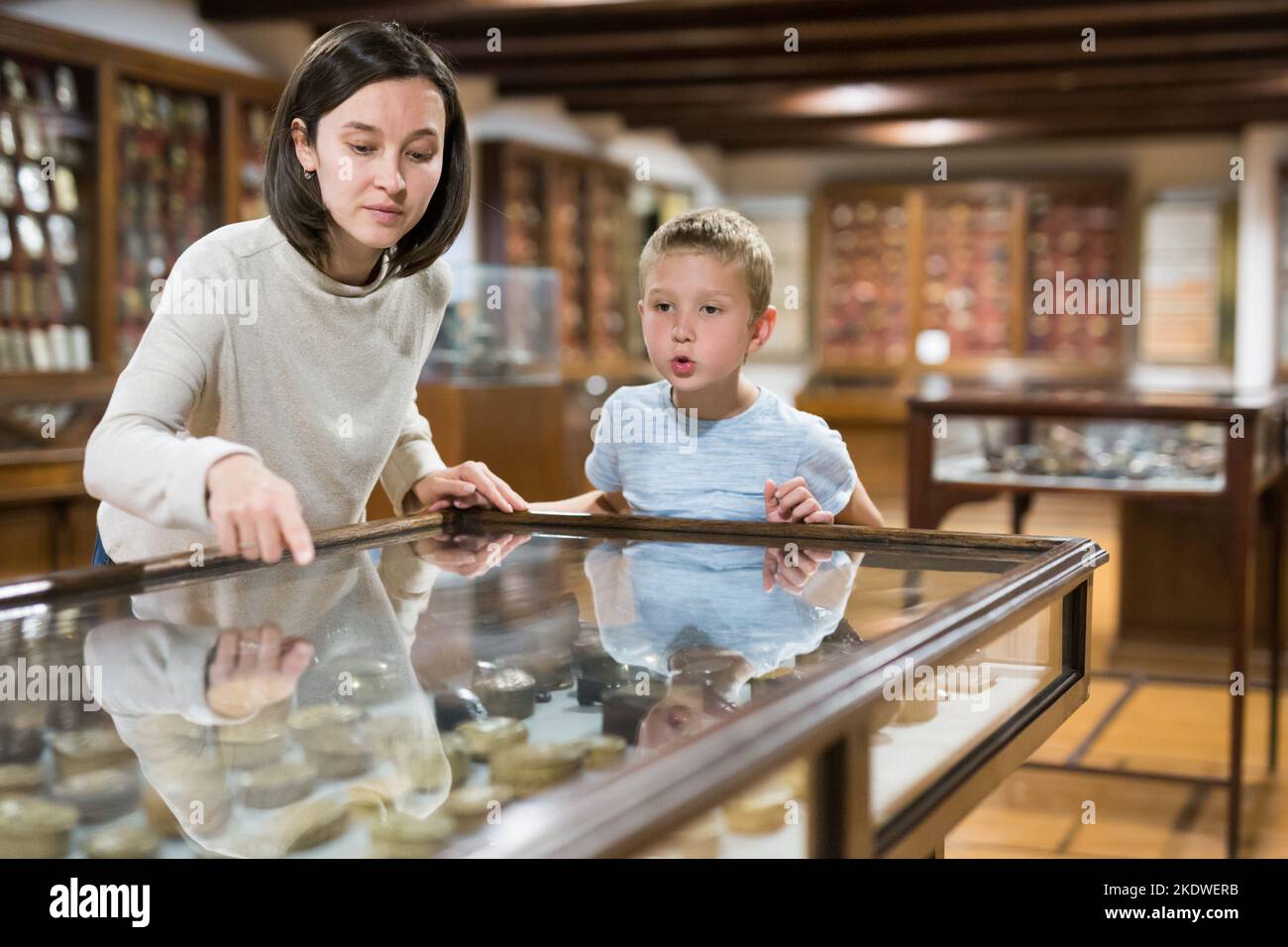 Woman and boy exploring artworks in museum Stock Photo - Alamy