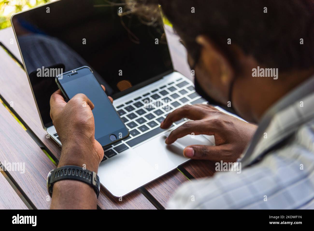 man person working with laptop computer and reading message from modern ...