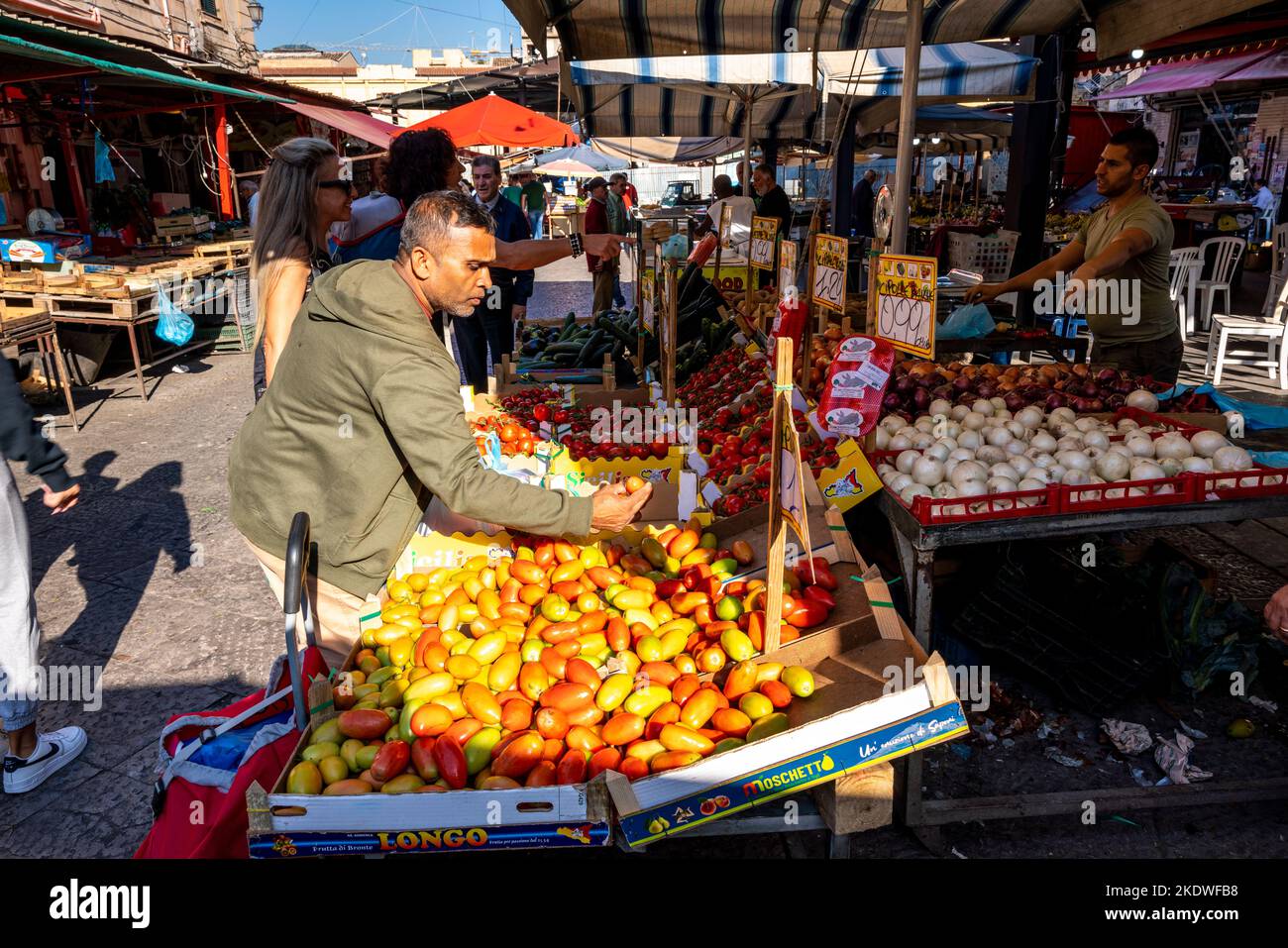 A Local Man Shopping For Fruit and Vegetables At The Ballaro Street ...