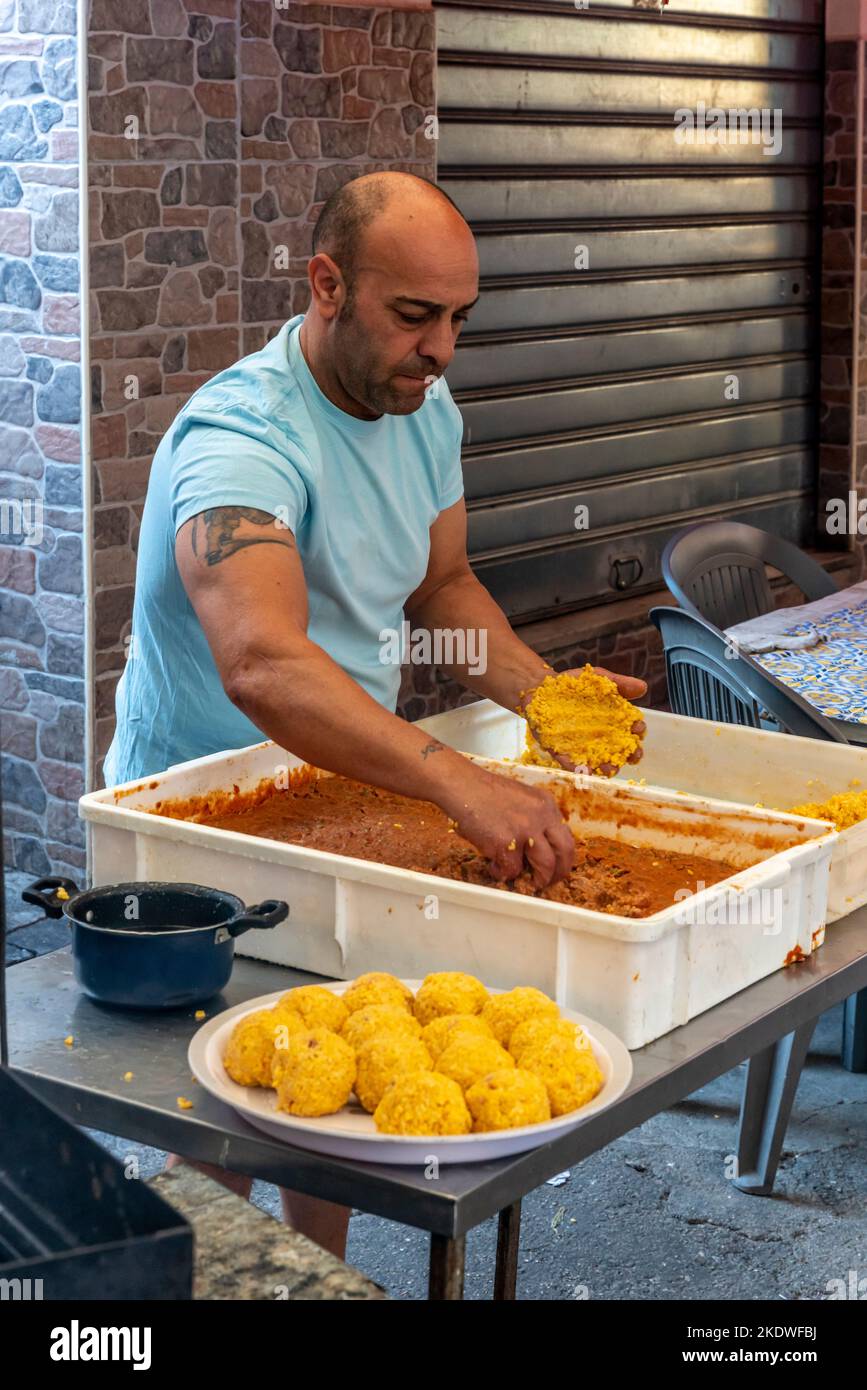 A Local Man Makes The Tradiitional Arancini (Rice Balls) At The Ballaro Street Market, Palermo ...