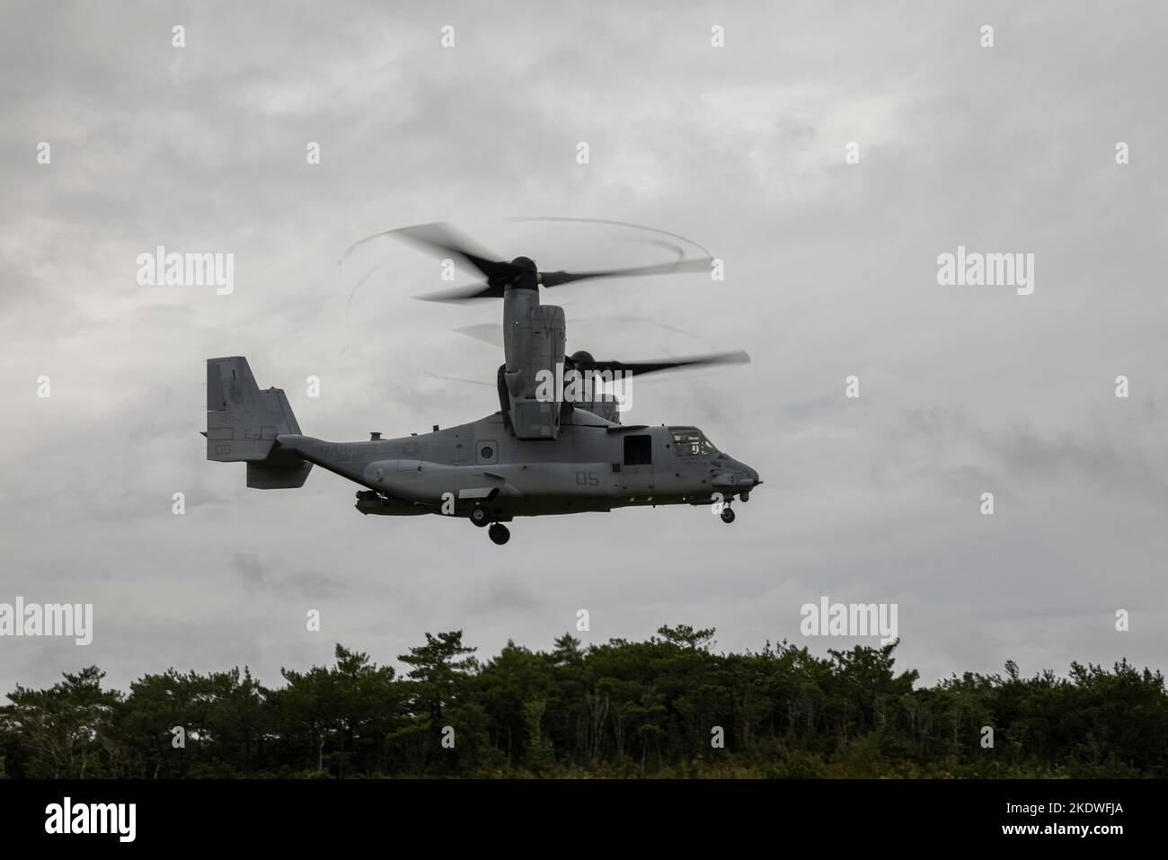 U.S. Marines with III Marine Expeditionary Force (MEF) fast rope from ...