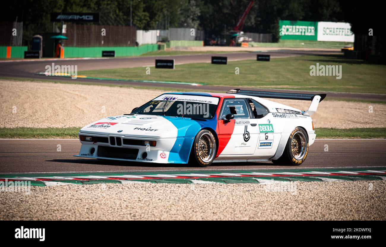 BMW M1 vintage car racing on track old fashioned motor sport. Imola ...