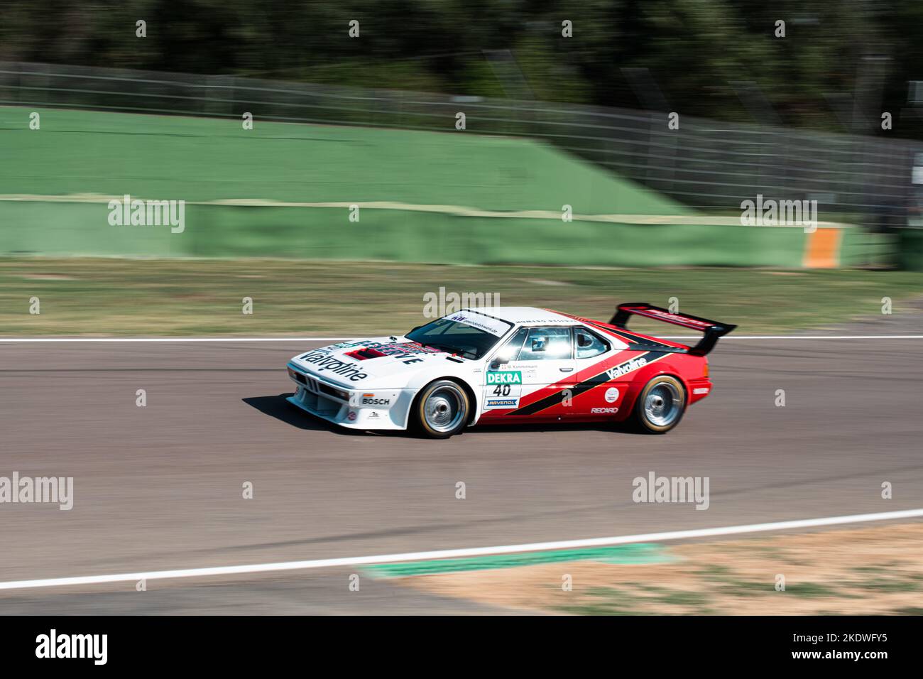 BMW M1 vintage car racing on track old fashioned motor sport. Imola ...