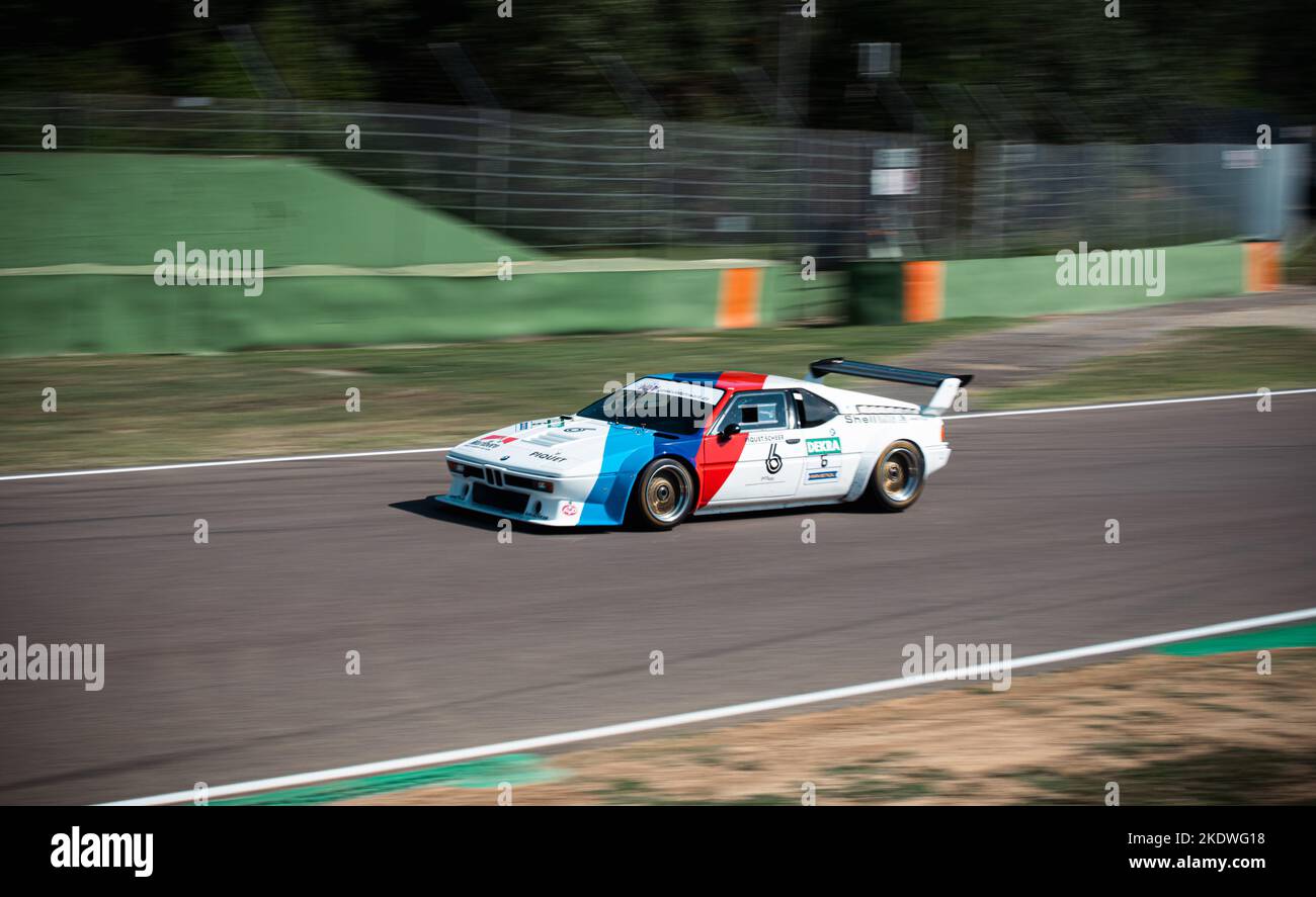 BMW M1 vintage car racing on track old fashioned motor sport. Imola ...